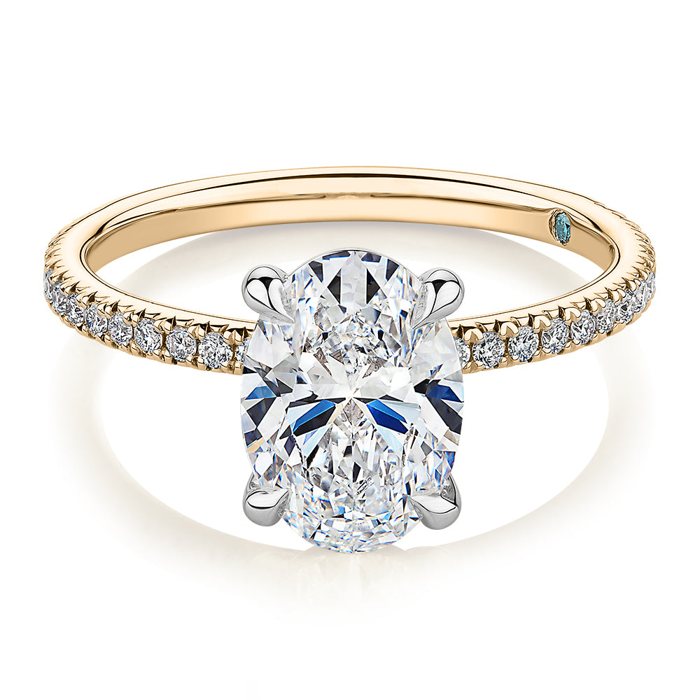 Premium Certified Lab Grown Diamond 2.24 carat TW oval and round brilliant shouldered engagement ring in 14 carat yellow and white gold